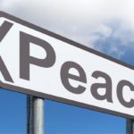 highway sign that reads "peace"